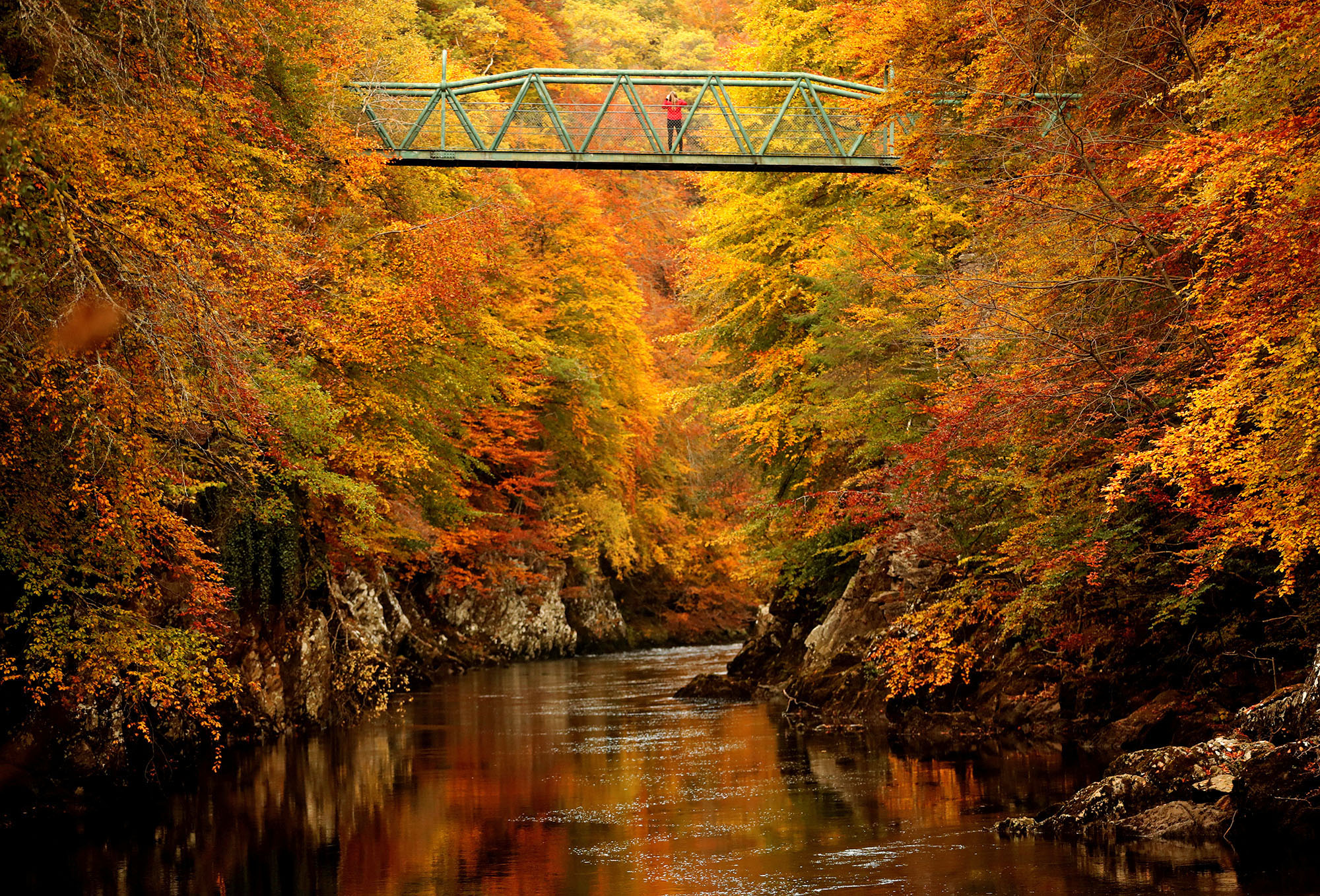 A footbridge over the River Garry near Pitlochry, Scotland, on October ...