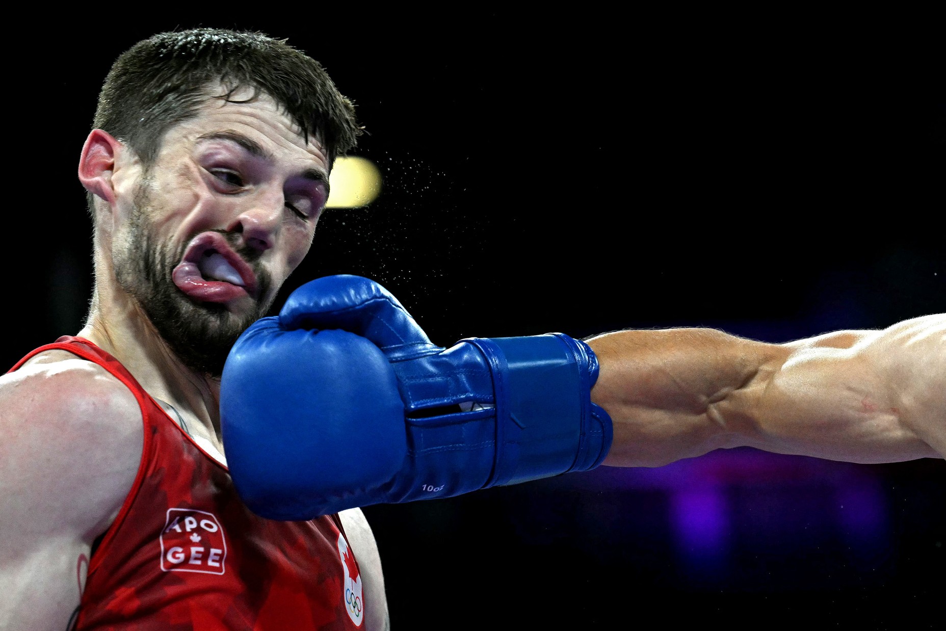 Wyatt Sanford takes a punch during an Olympic boxing match - The Atlantic