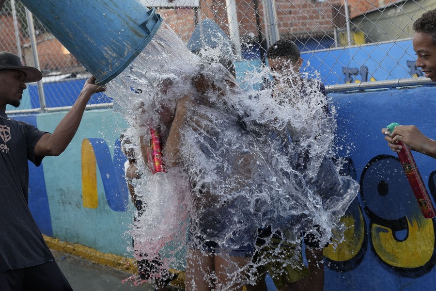 Photos of the Week: Surf Torch, Lion Dance, Pancake Race - The Atlantic