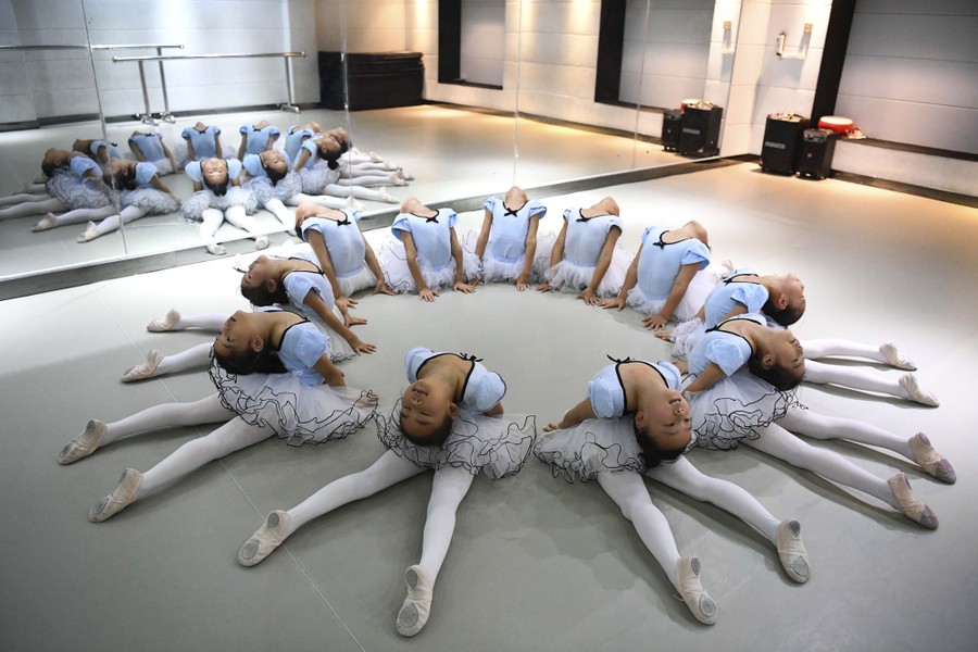 Photos of the Week: Toxic Beauty, Giant Boots, Twilight Swimming - The ...