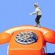 photo of a child walking on top of a landline