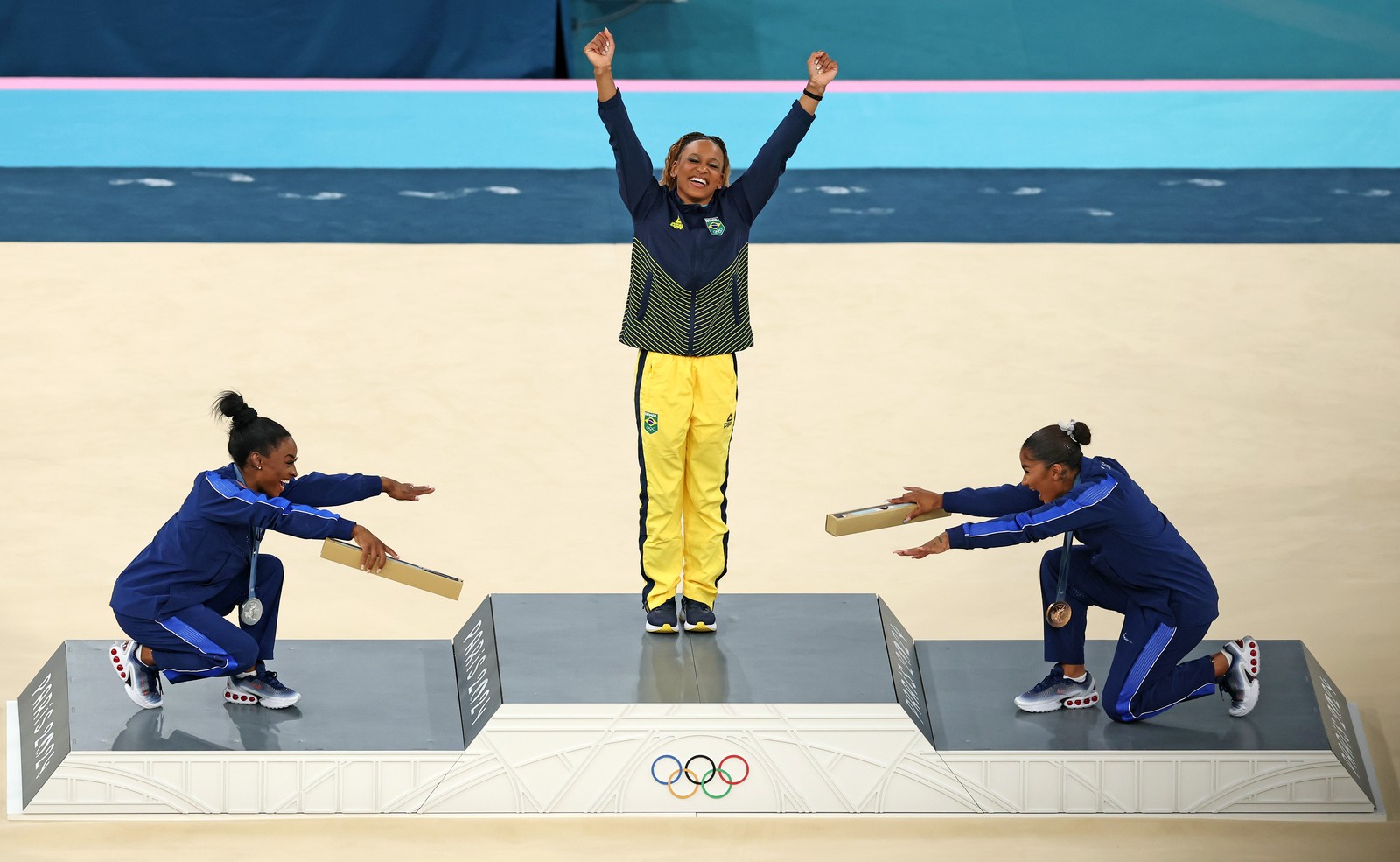 Team USA's Simone Biles and Jordan Chiles bow down to Brazil's Rebeca ...