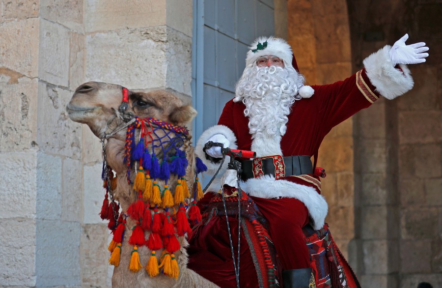 Photos of the Week: Impeachment Vote, Surfing Santa, Flying Hooves ...