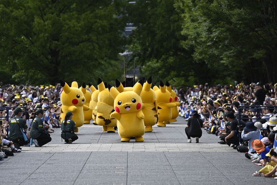 Photos of the Week: Artistic Cycling, Mounted Shooting, Pikachu Parade ...