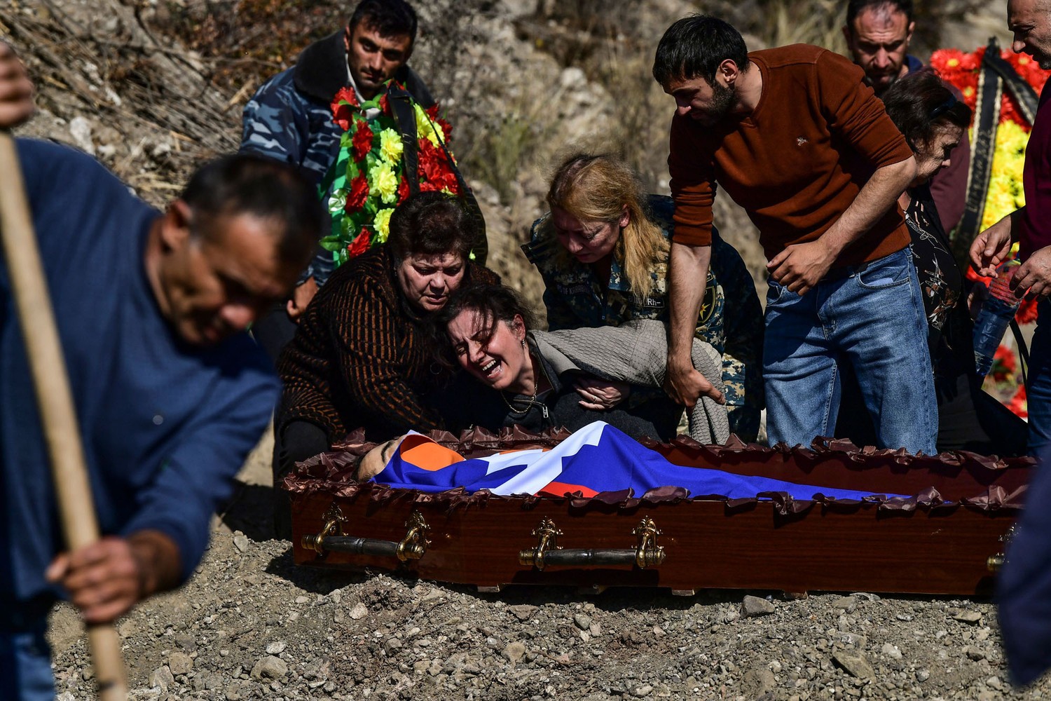 Aris Messinis, A mother mourns above a coffin with the body of her son ...