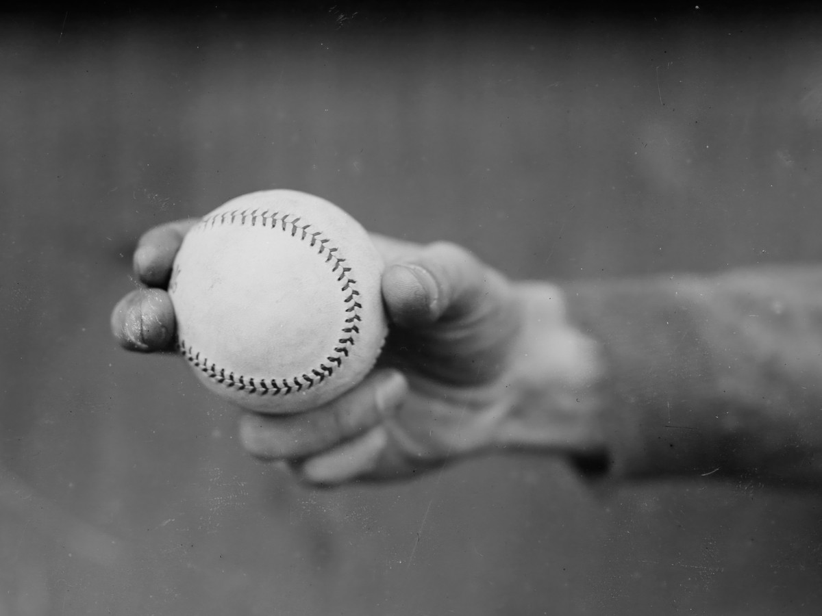 hand holding baseball