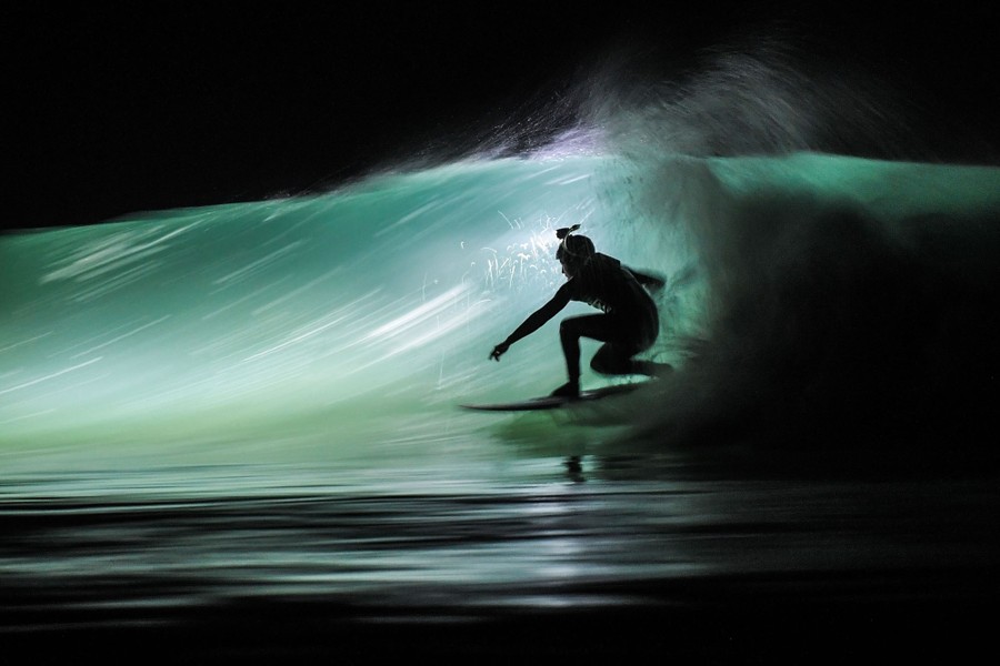 Photos of the Week: Night Surfing, Burning Moorland, Trapped Rat - The ...
