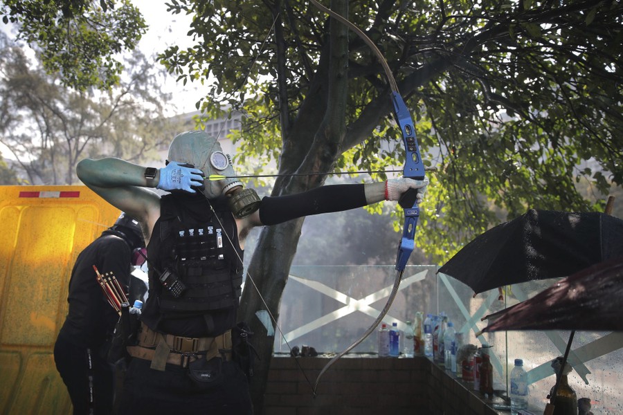 Photos: Hong Kong Riot Police Lay Siege to University Occupied by ...