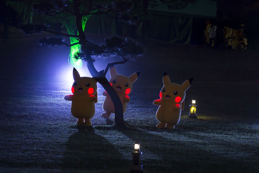 Photos of the Week: Pikachu Outbreak, Dinosaur Crossing, Ducky Derby ...
